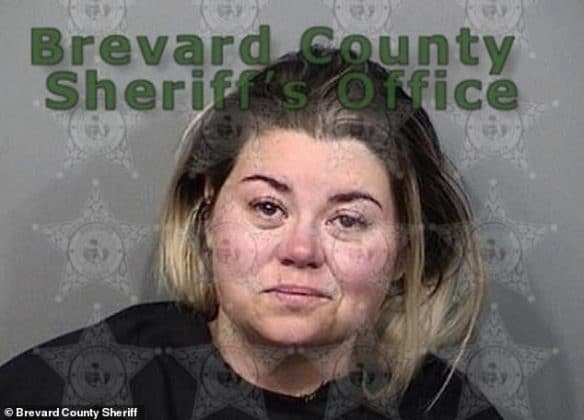 Audra Adams Melbourne FL woman tries to kiss strangers at bar calls 911