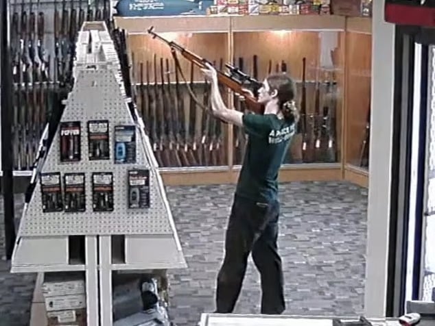 Gun shop footage shows 'grinning' & jovial Robin Westman shopping for ...